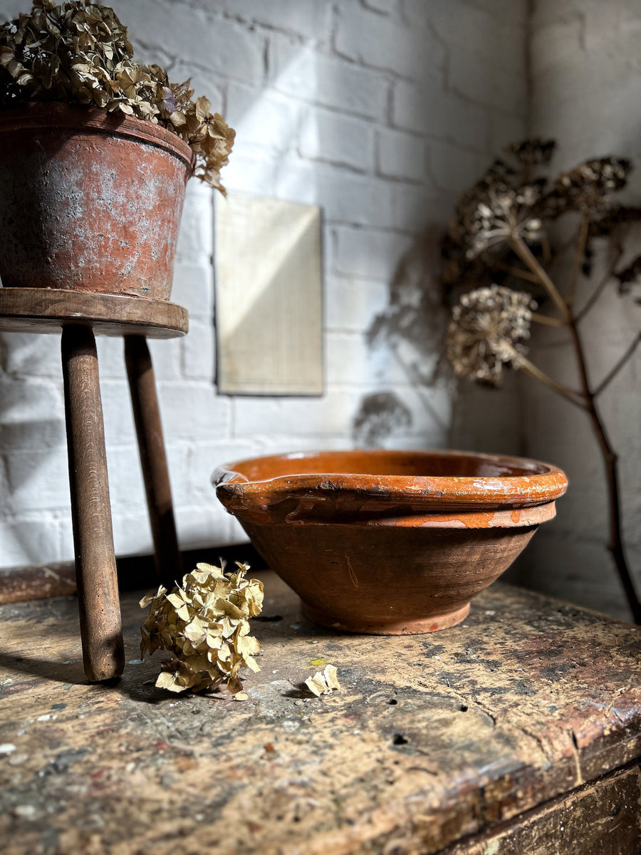 A large antique, French country kitchen, terracotta glazed, mixing, po ...