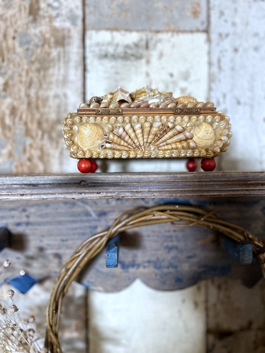 A Vintage art deco style shell covered jewellery box with red ball fee ...
