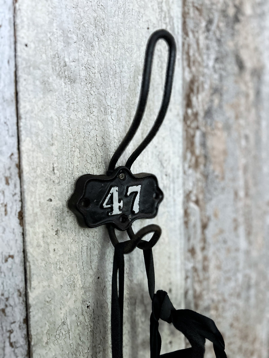 A Vintage industrial cast iron numbered shield back coat hook number 4 ...